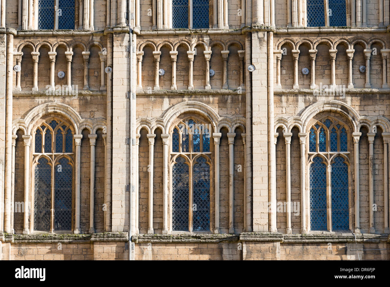 Windows and decorative stonework on Peterborough Cathedral UK Stock ...