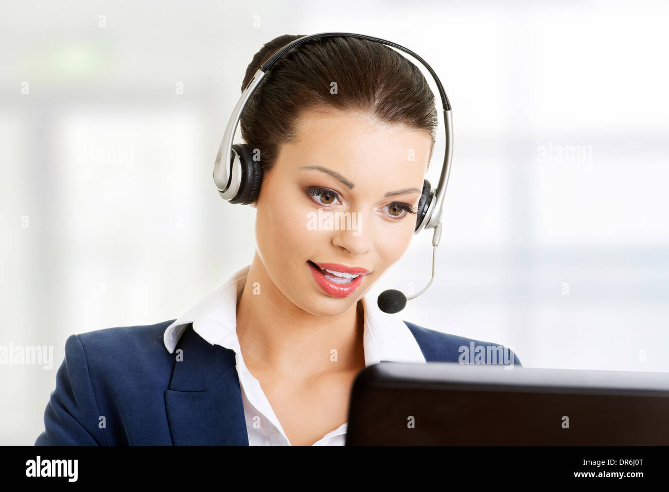 Beautiful young call-center assistant smiling , isolated on white Stock ...