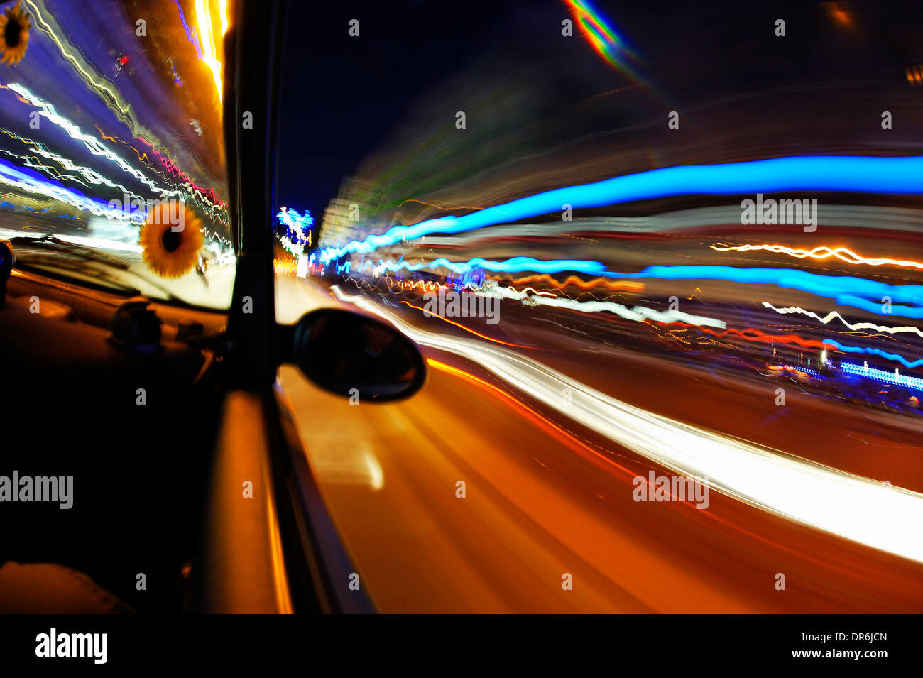 Dynamic driving through neon lights Stock Photo - Alamy