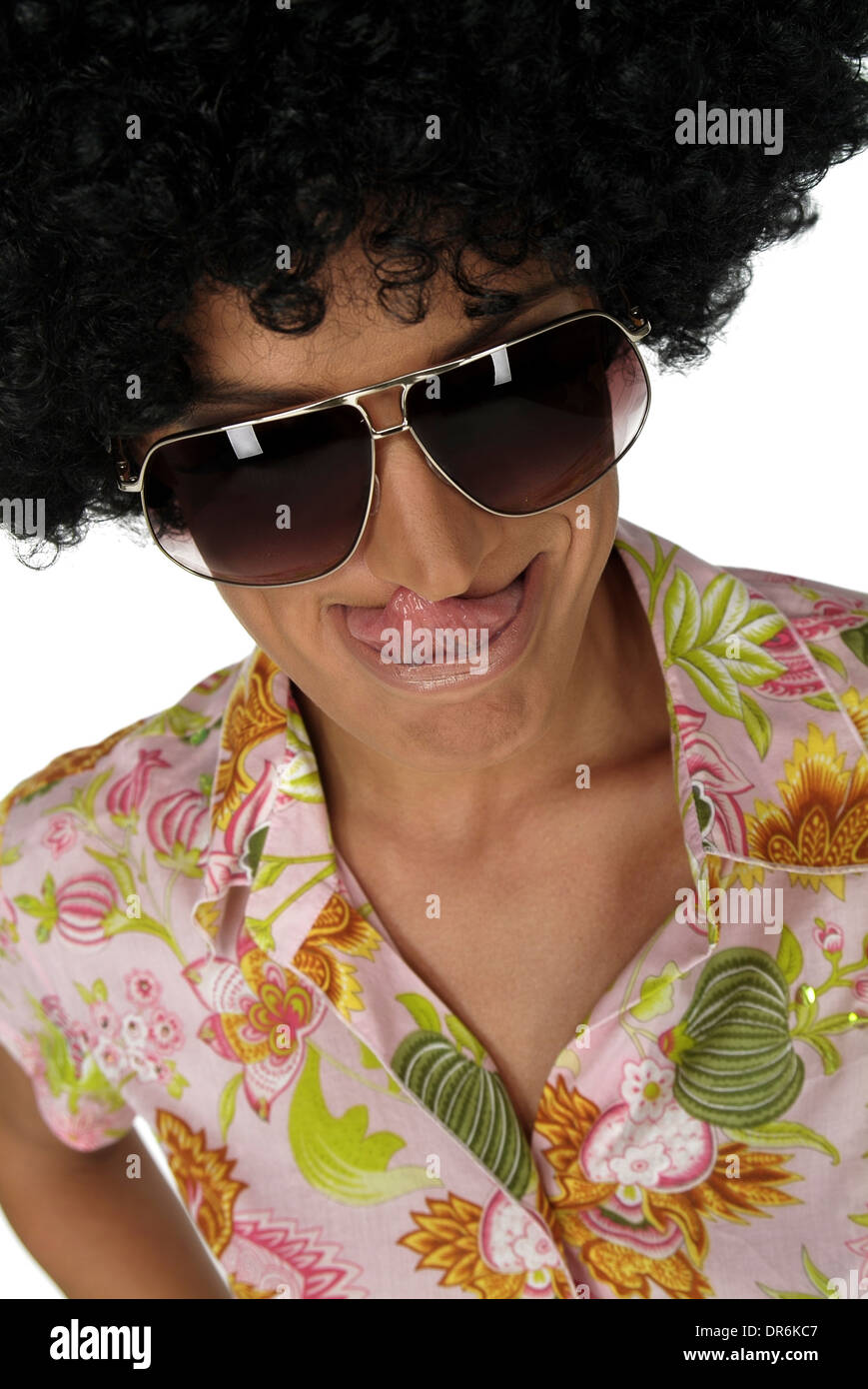 Portrait of funky young woman sticking out tongue and making rebellious ...