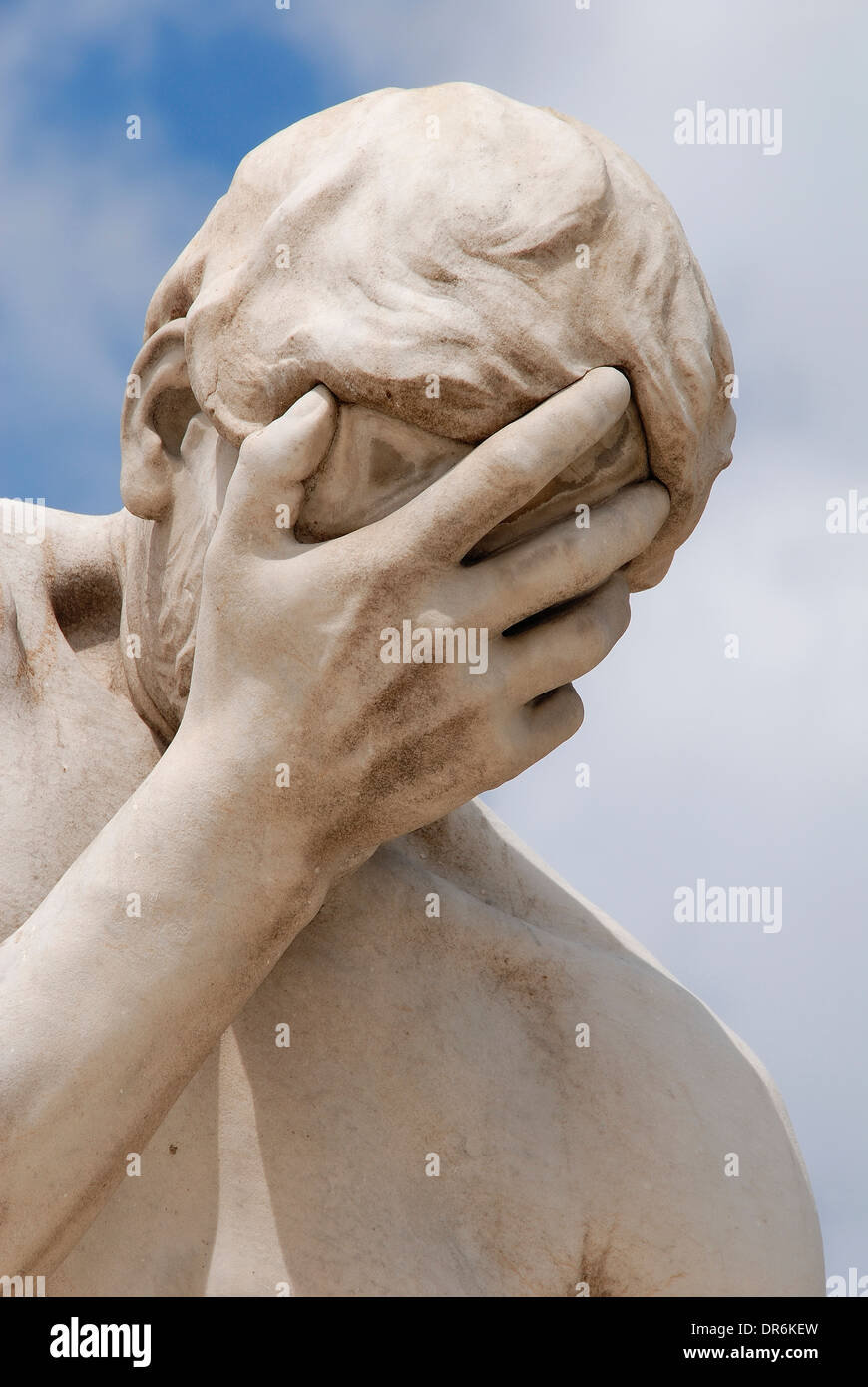 Statue of a man putting his hand on his head Stock Photo - Alamy