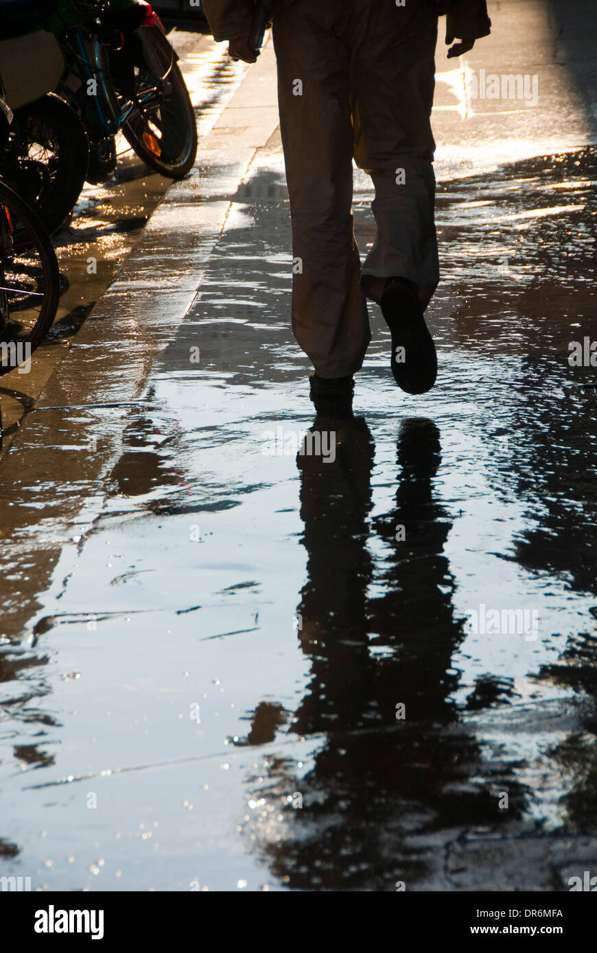 Lower section of a man walking Stock Photo - Alamy