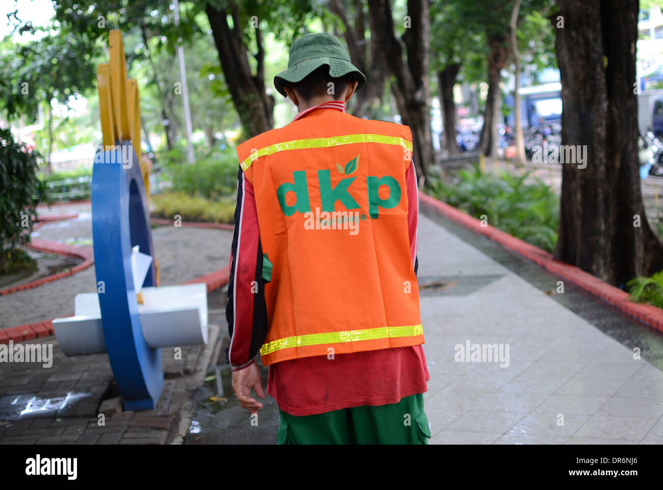 A janitor cleaning and caring for Bungkul Park - The Best City Park In ...