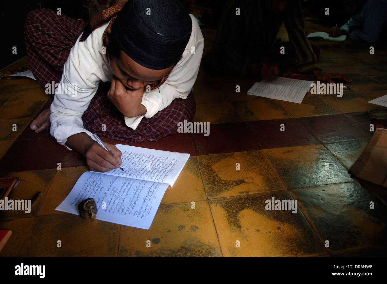 The students write in Arabic in the islamic boarding school Lirboyo ...