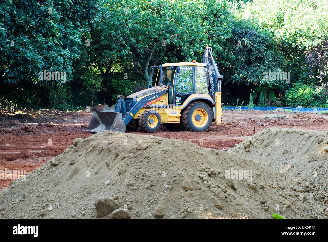 Grader digging and preparing the soil land for a house build Stock ...