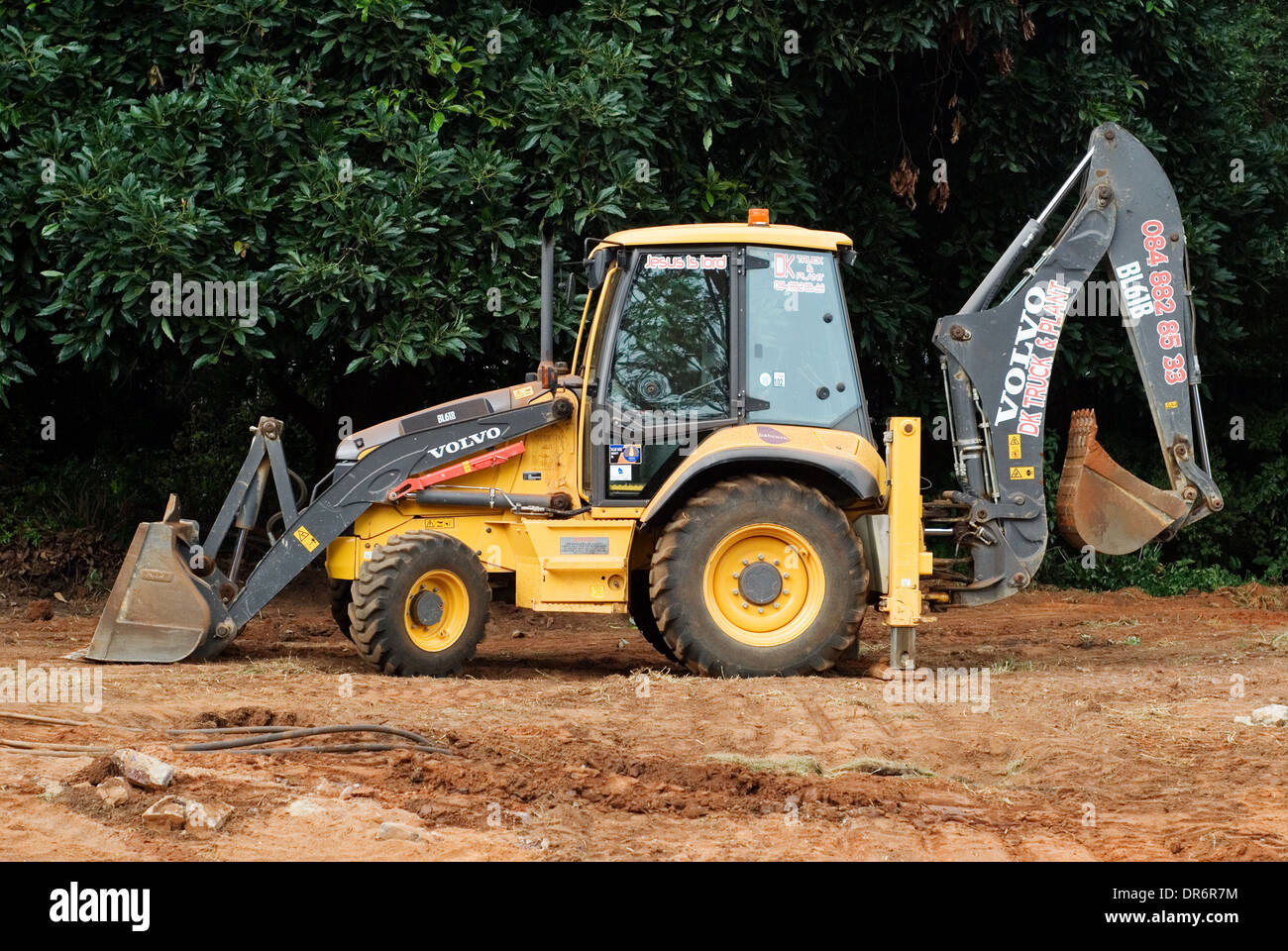 Side view of a construction grader on site of a house build Stock Photo ...
