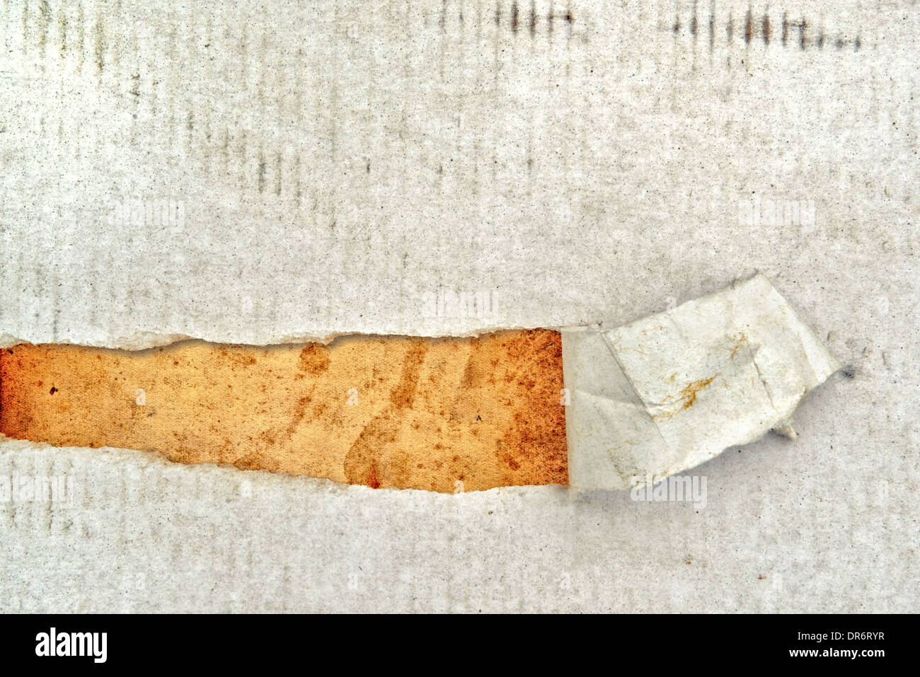 Torn dirty cardboard paper as a background for your title or design ...