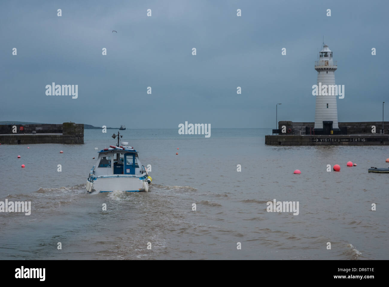 Boat leaving Harbour Stock Photo - Alamy