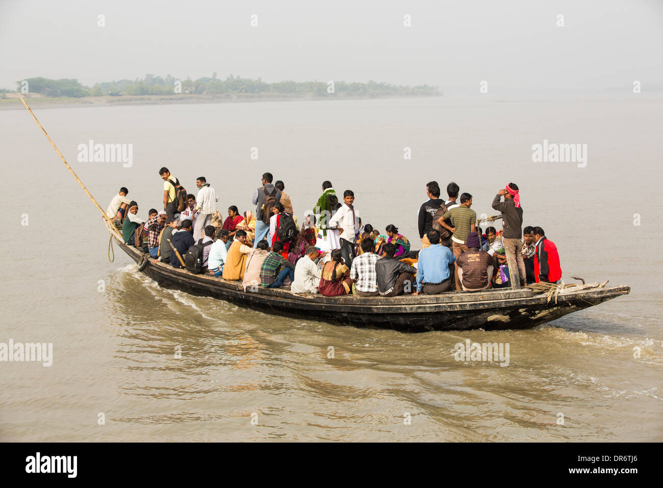 Boats carrying people and goods in the Sunderbans, a low lying area of ...