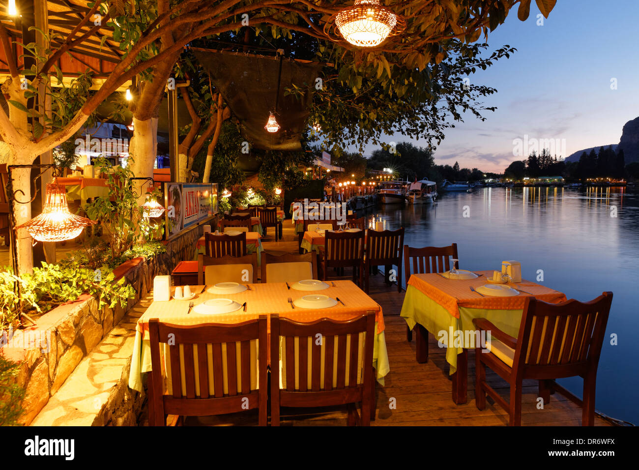 Turkey, Province Mugla, Laid tables in a restaurant at Dalyan River ...