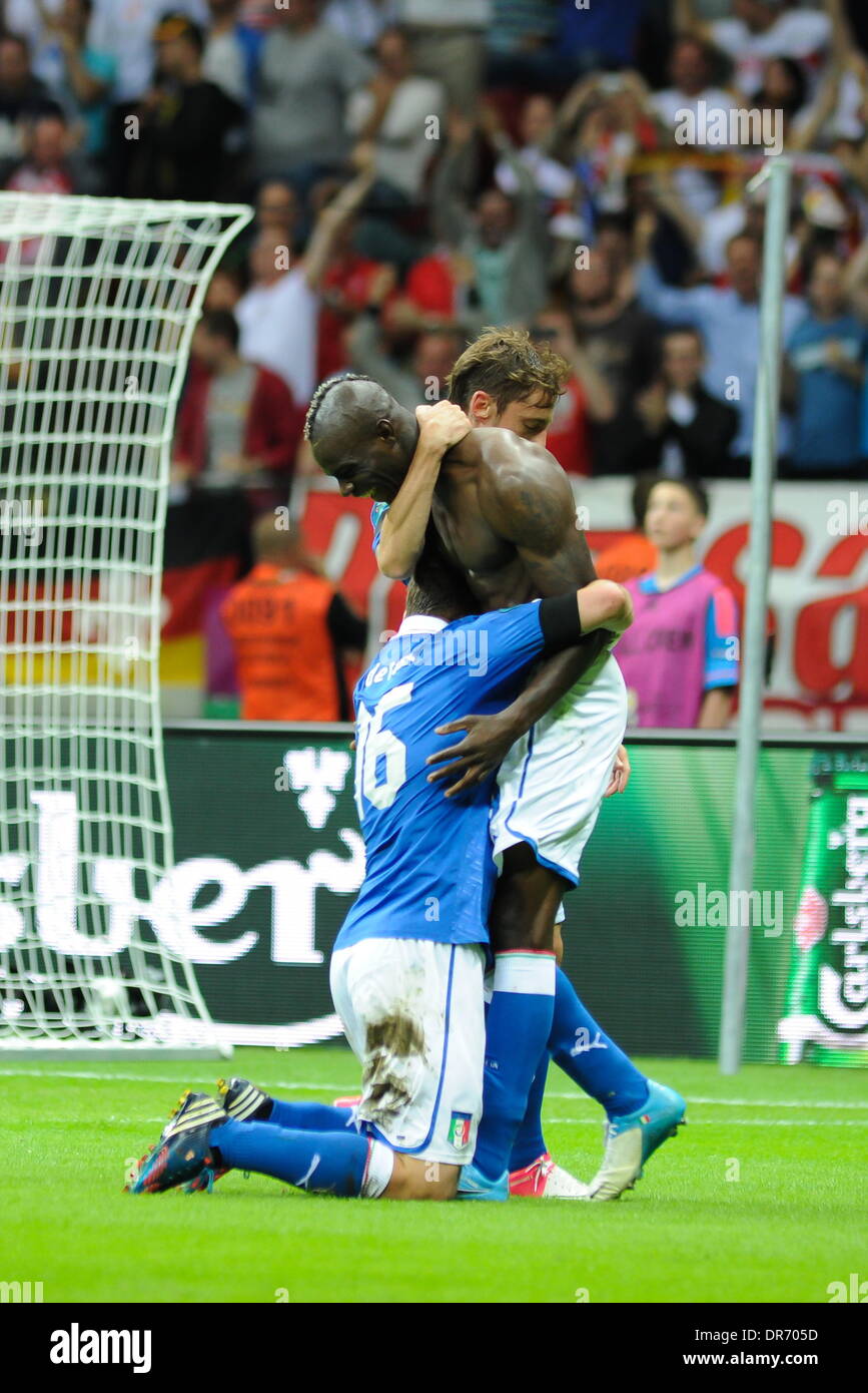 Mario Balotelli of Italy takes off his jersey after scoring his second ...