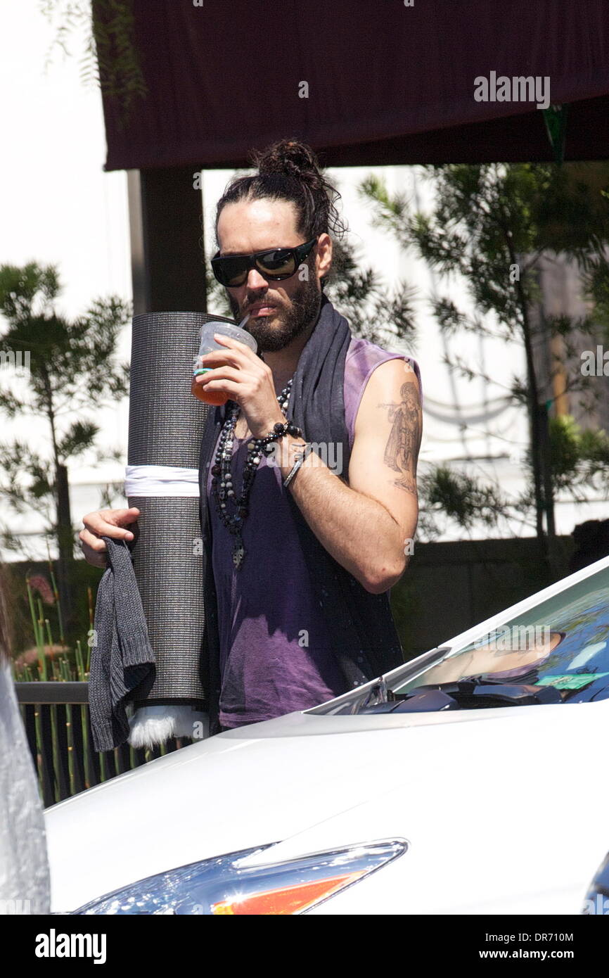 Russell Brand drinking an iced tea as he leaves his yoga class Los ...