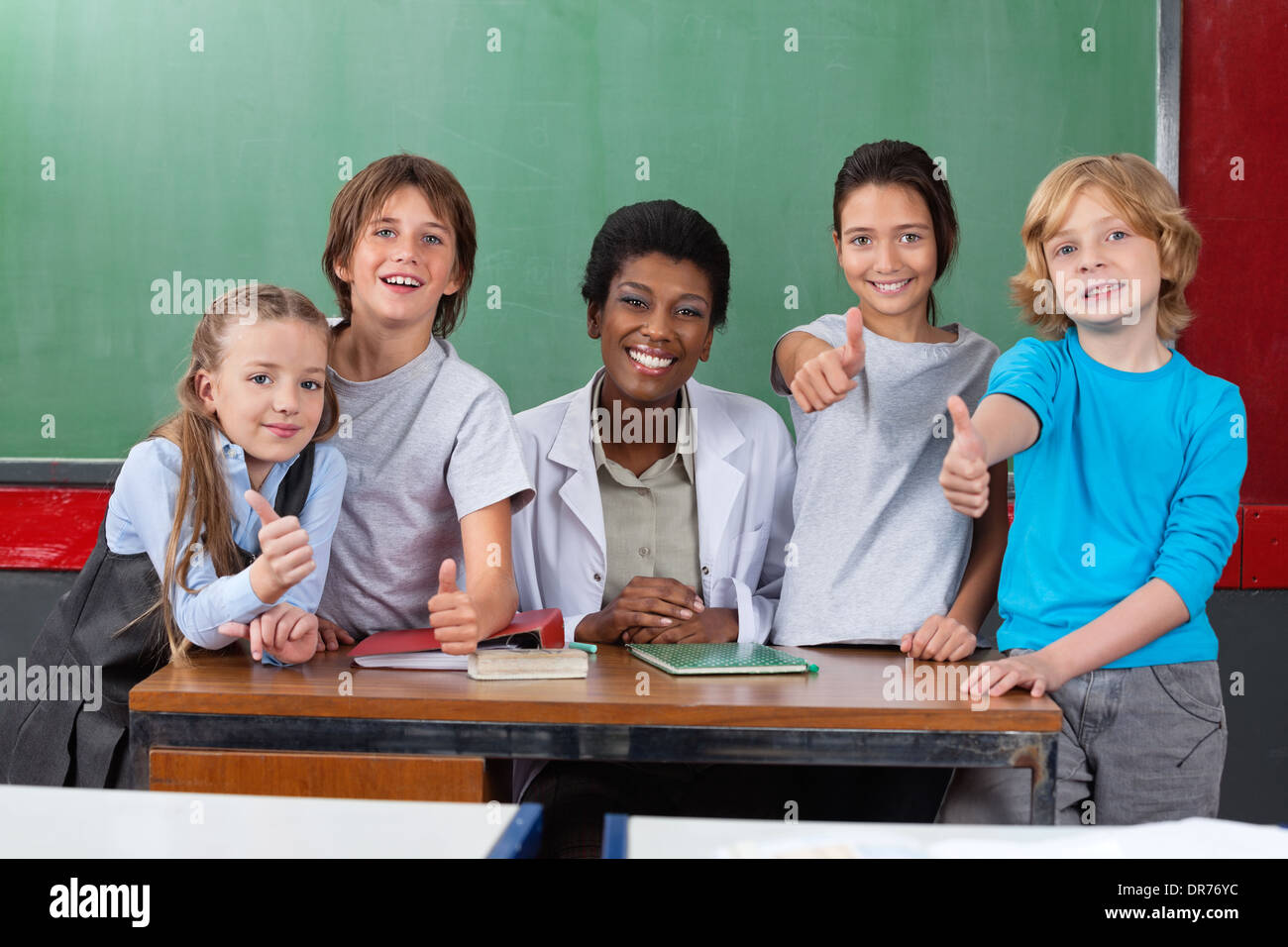 Schoolchildren Gesturing Thumbs Up Stock Photo - Alamy