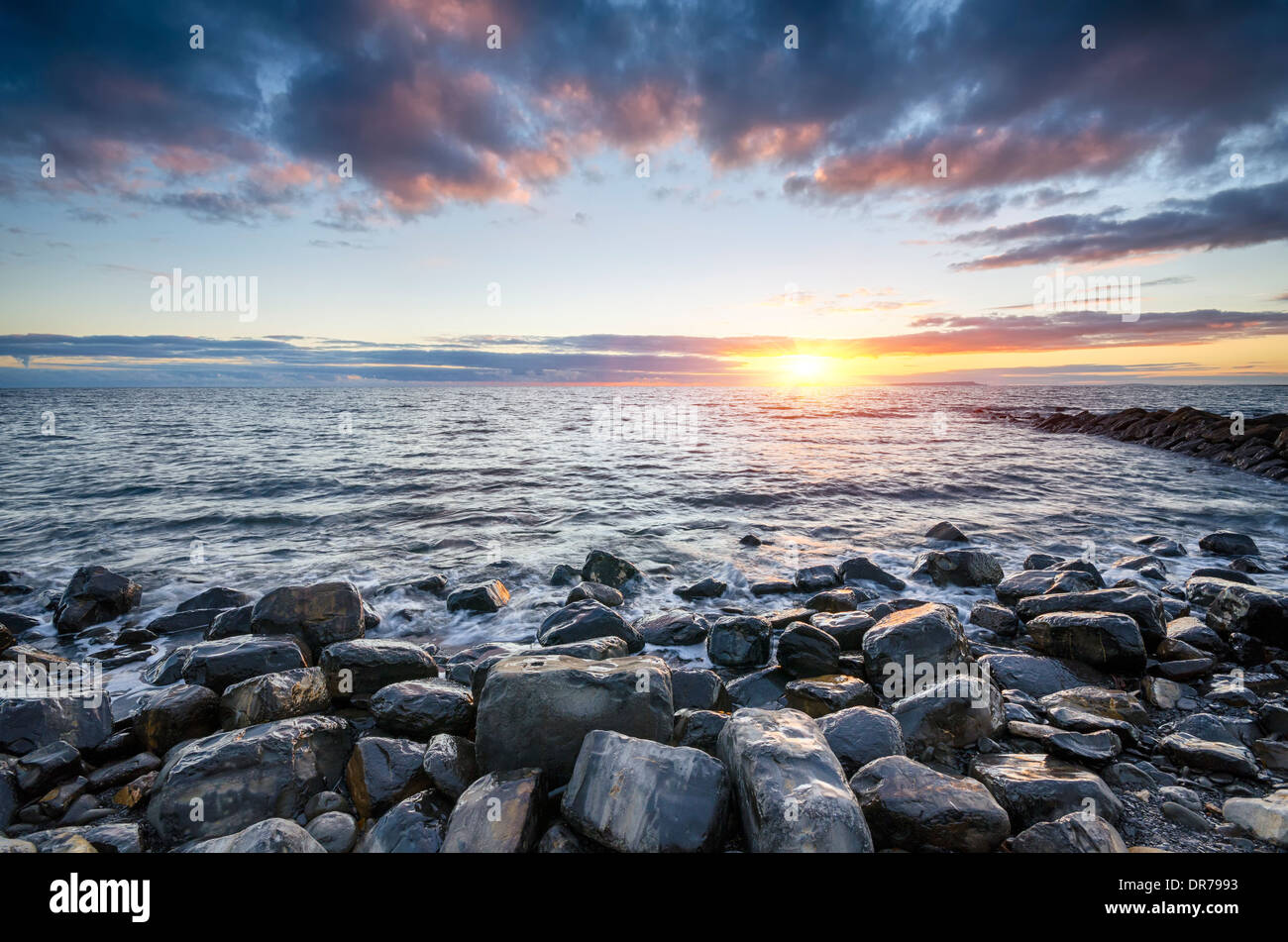 Sunset at Kimmeridge beach on the Jurassic Coast in Dorset Stock Photo ...