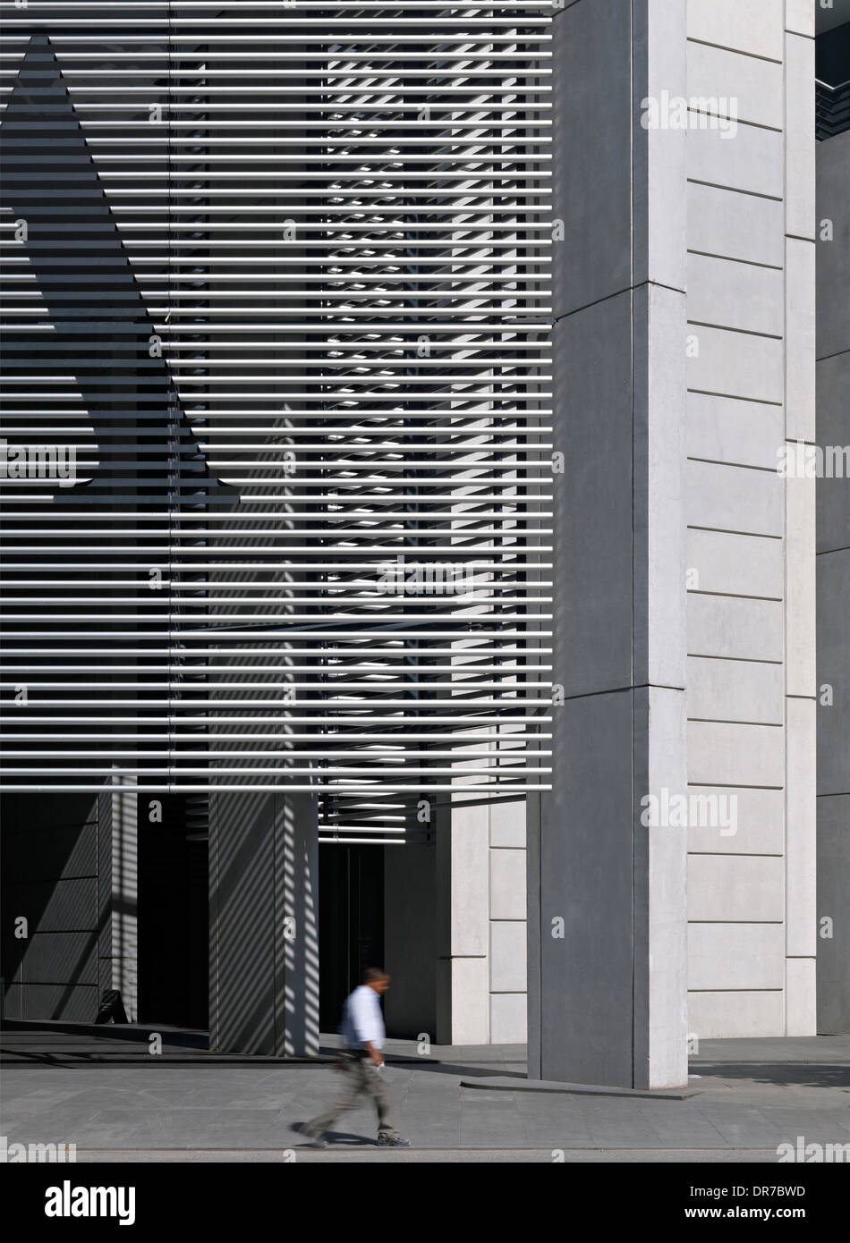 Man walking past The Troika building, KLCC park, Malaysia Stock Photo ...