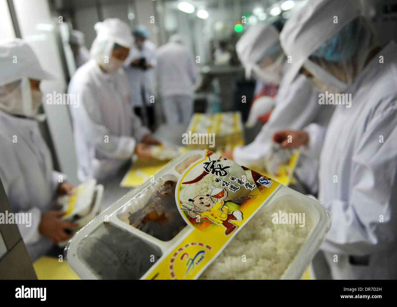 Qingdao, China's Shandong Province. 21st Jan, 2014. Workers prepare box ...