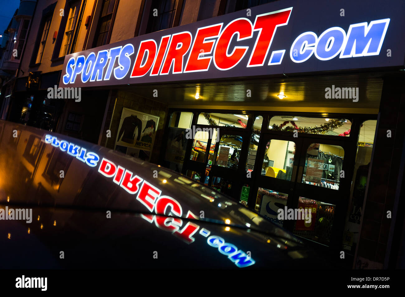 SportsDirect.Com illuminated sign outside a store shop UK Stock Photo ...