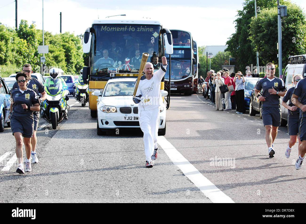 Amputee Jamie Andrew carries the Olympic Torch during the London 2012 ...