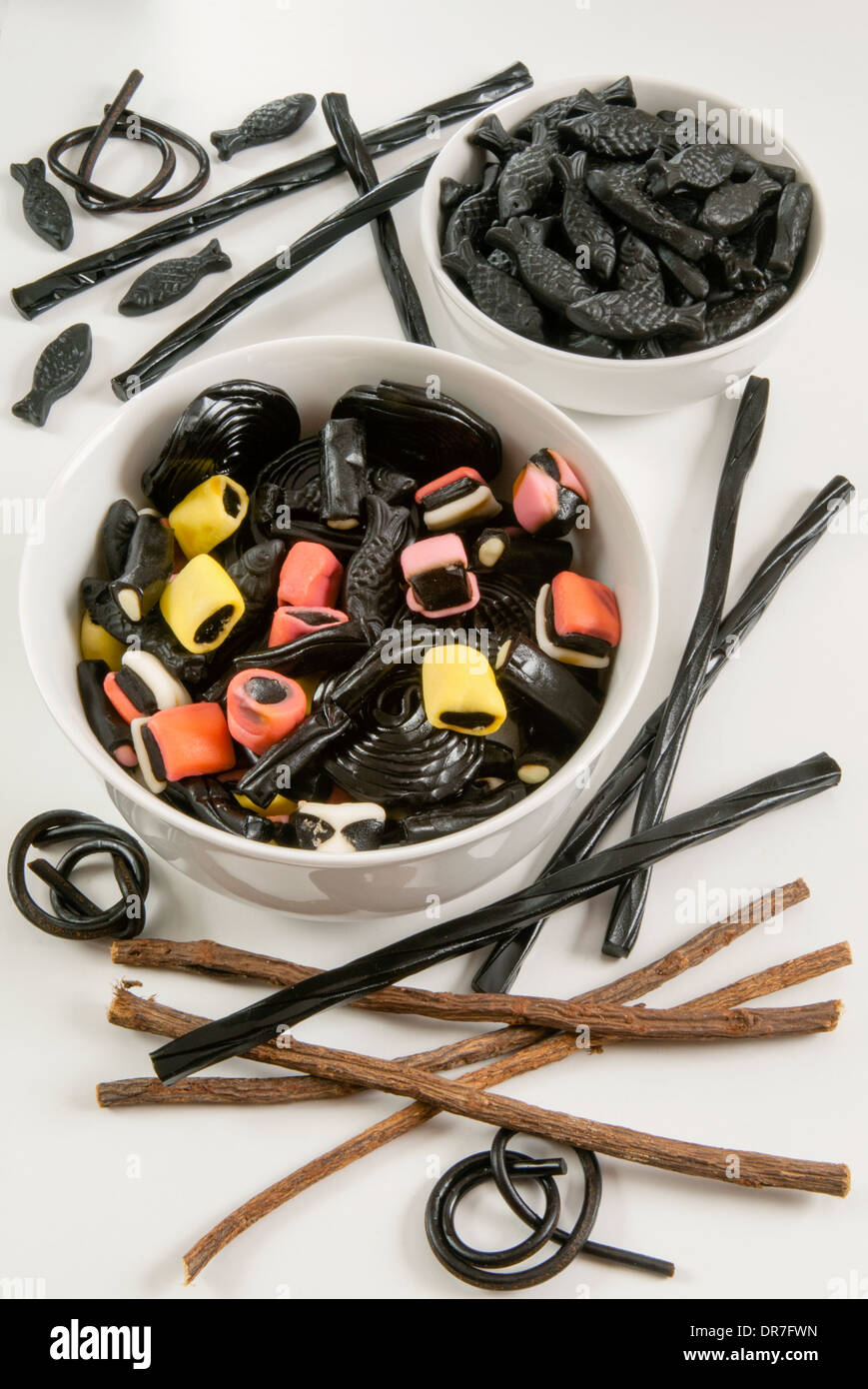 Liquorice roots and liquorice sweets Stock Photo - Alamy
