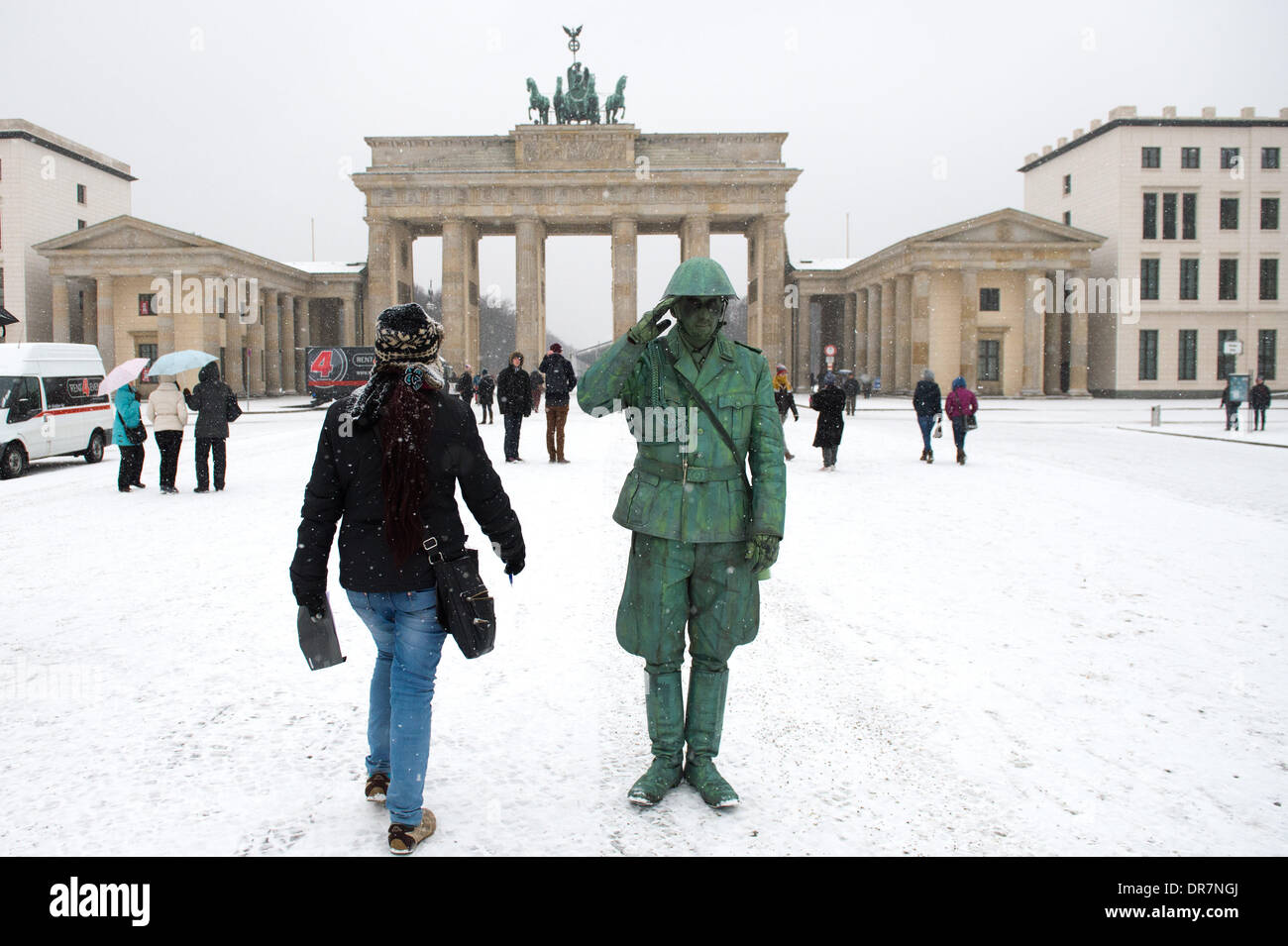A street artist depicting a GDR soldier stands infront of Brandenburg ...