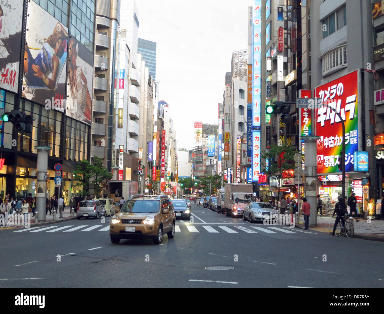 Neon signs frame a street in the Shibuya district of Tokyo, Japan, 25 ...