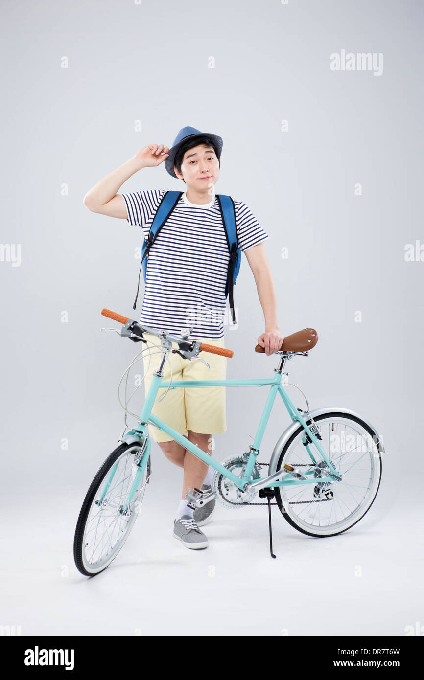 a man posing with a bike Stock Photo - Alamy