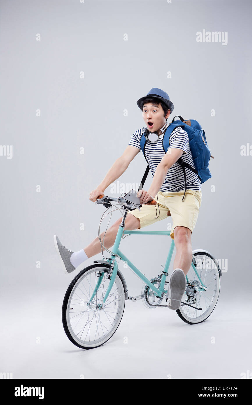 a man riding a bike Stock Photo - Alamy