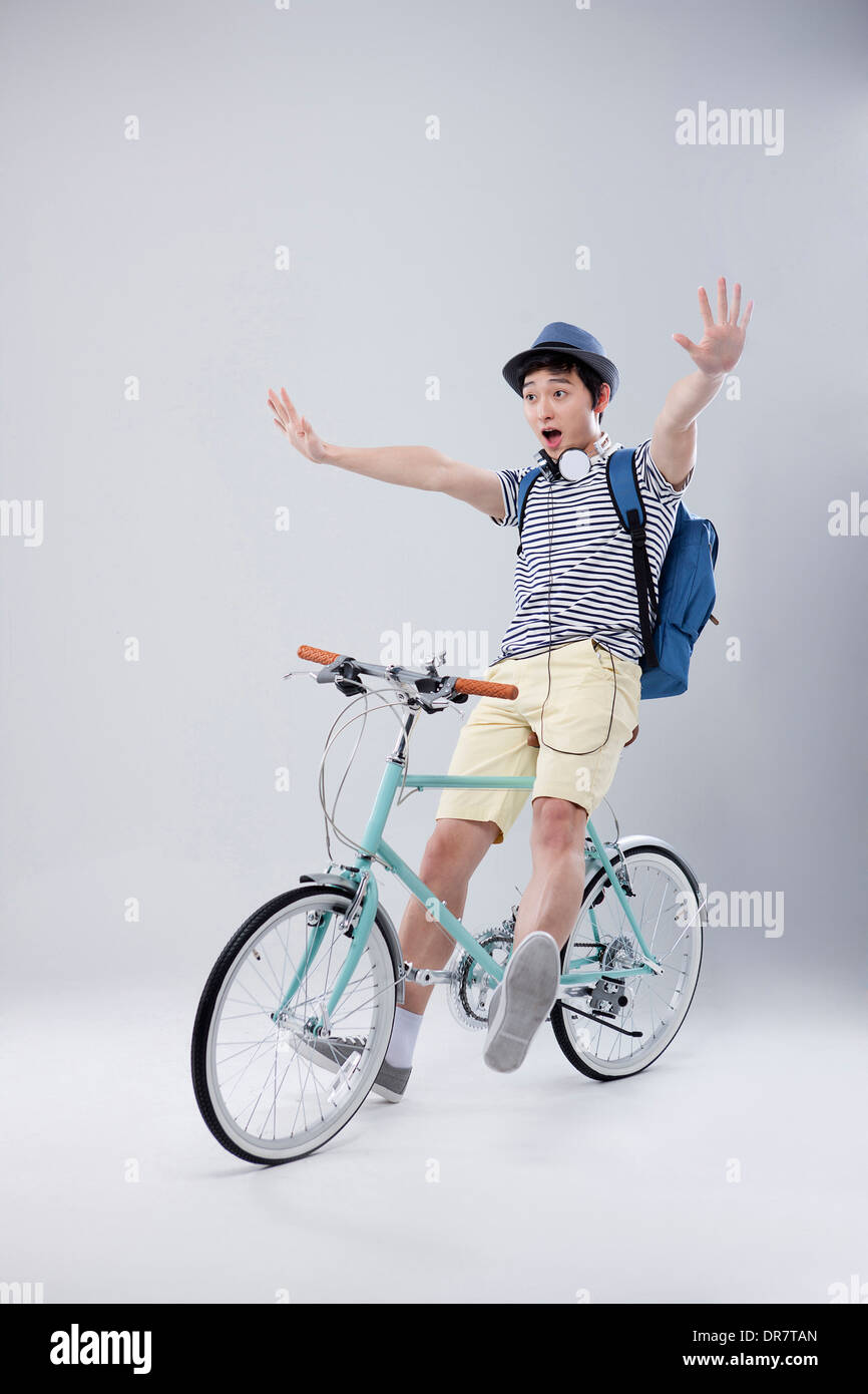 a man riding a bike with hands off Stock Photo - Alamy