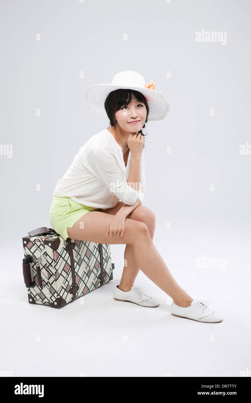 Suitcase sitting on side road hi-res stock photography and images - Alamy