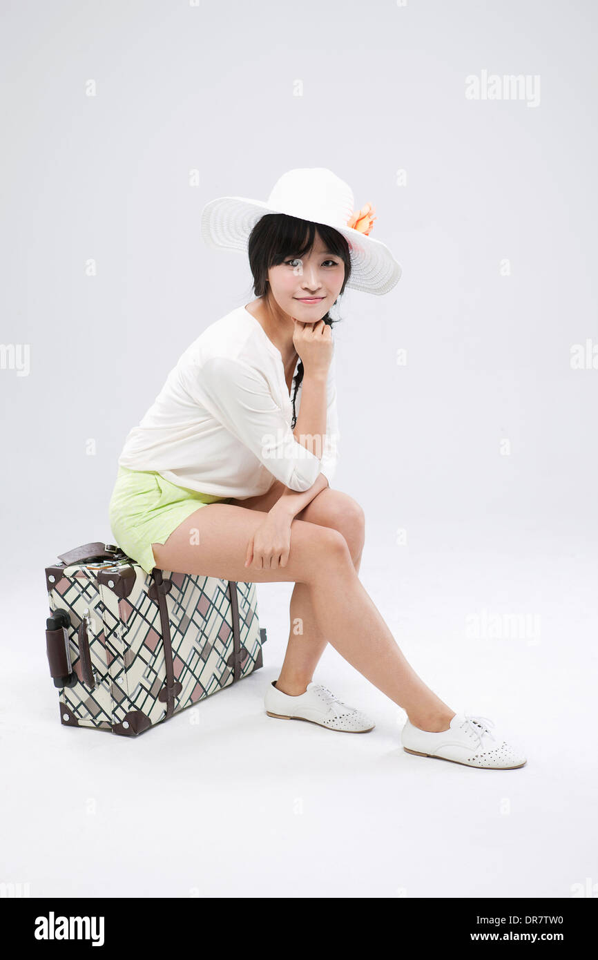 Suitcase sitting on side road hi-res stock photography and images - Alamy