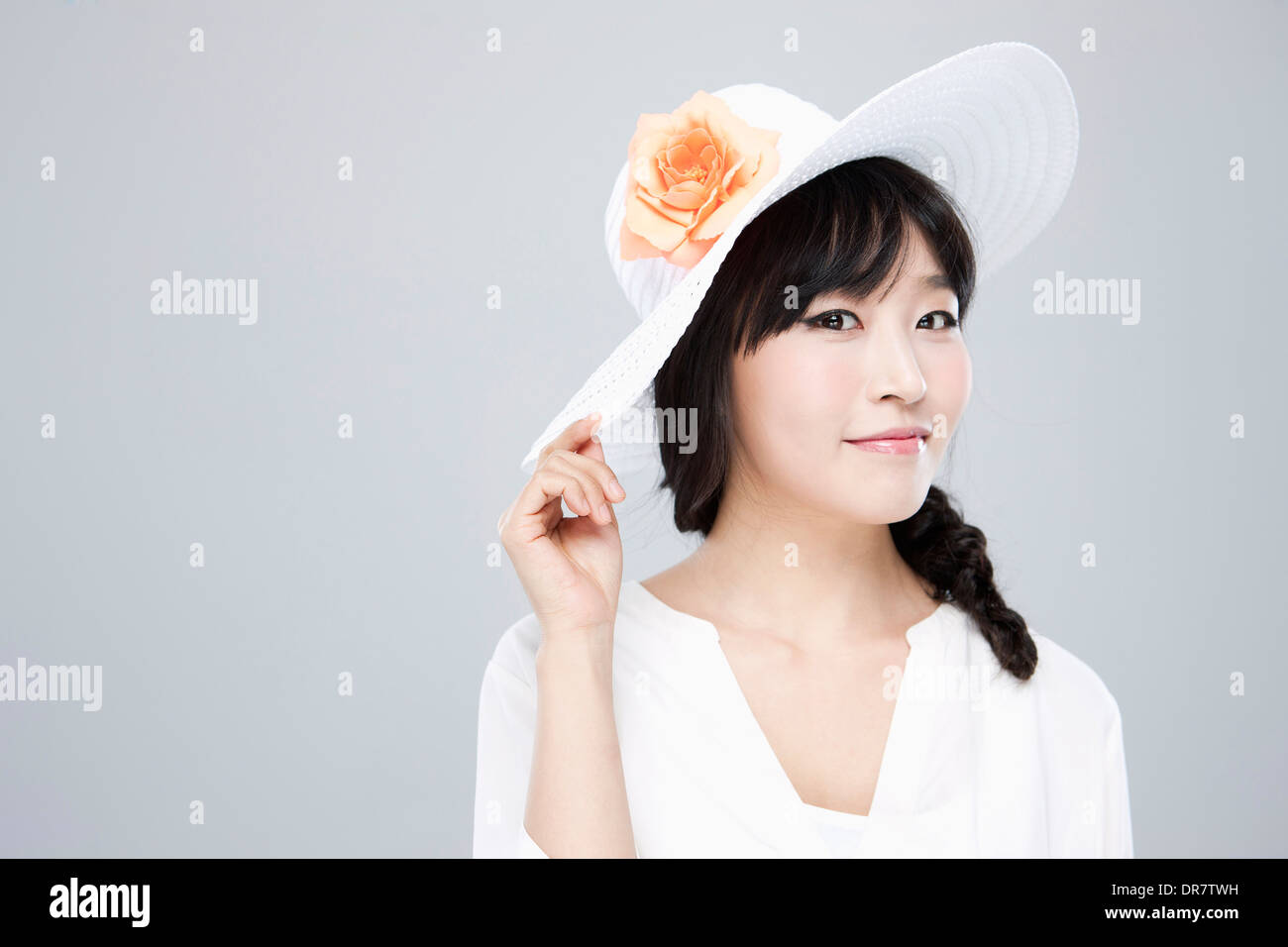 close up shot of a woman in white hat posing Stock Photo - Alamy