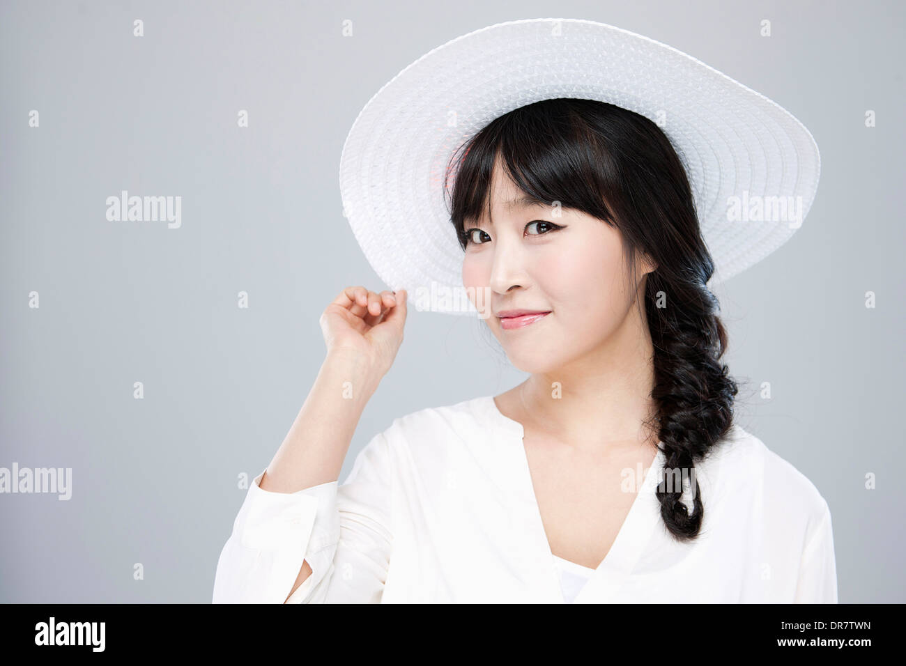 close up shot of a woman in white hat posing Stock Photo - Alamy
