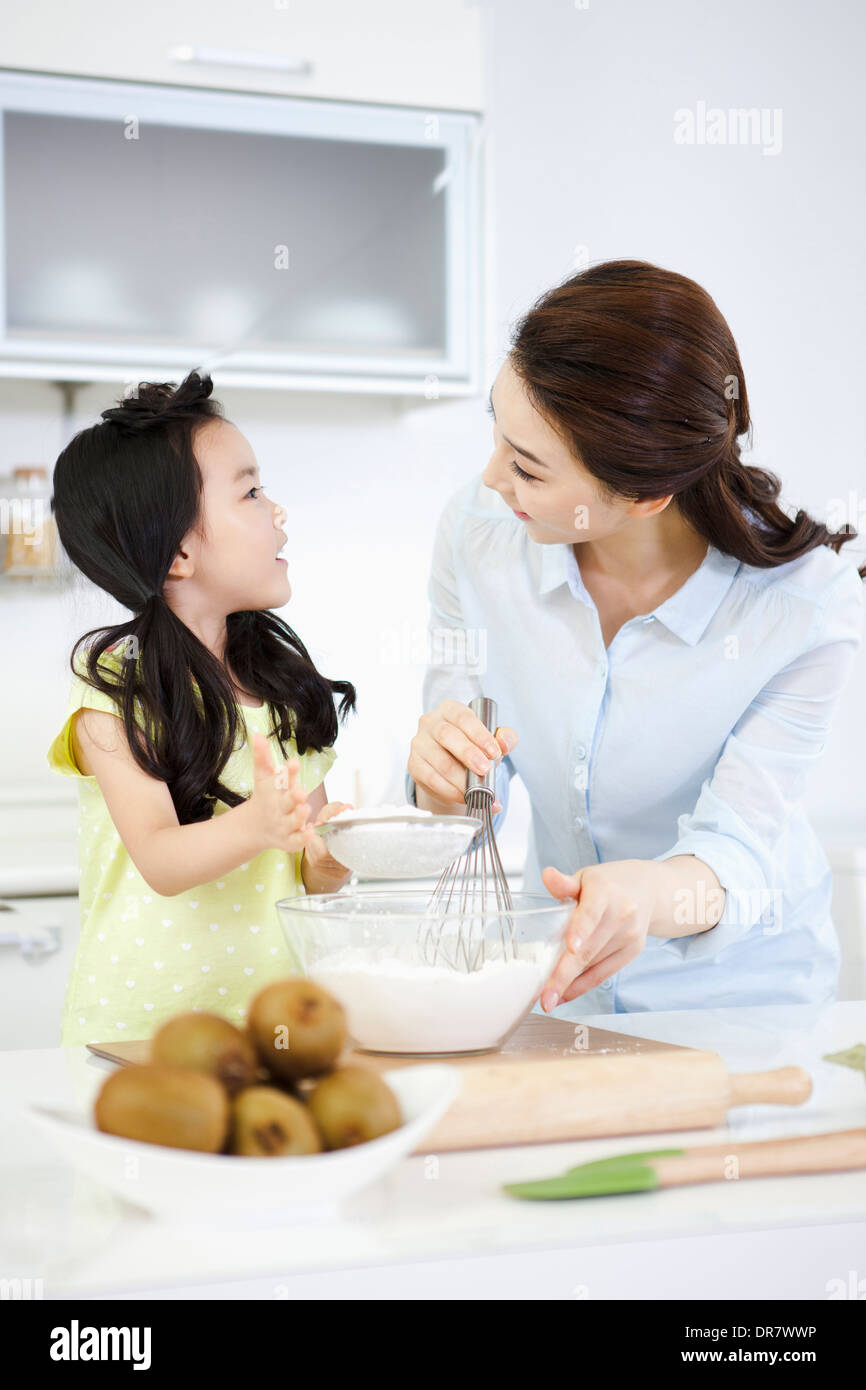 a mother and a daughter cooking together Stock Photo - Alamy