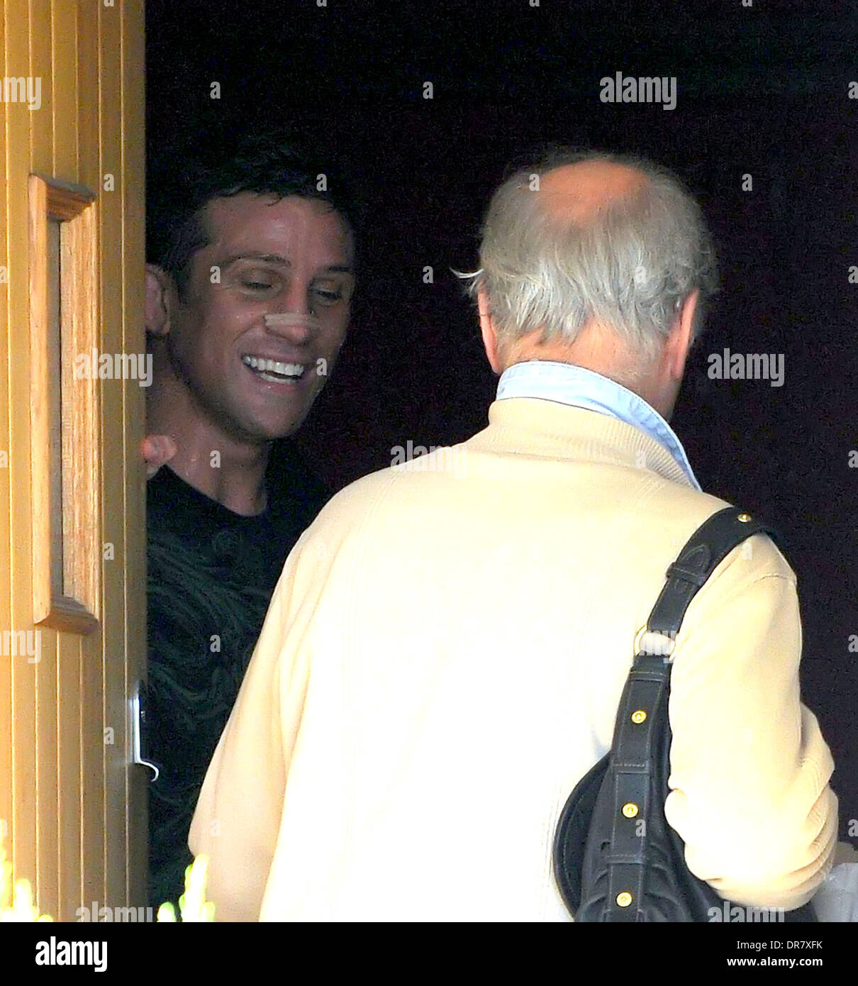 Alex Reid answers the door to his parents following the birth of his ...