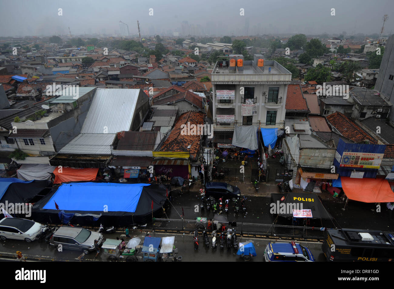 Jakarta, Indonesia. 21st Jan, 2014. Temporary shelters are seen on a ...