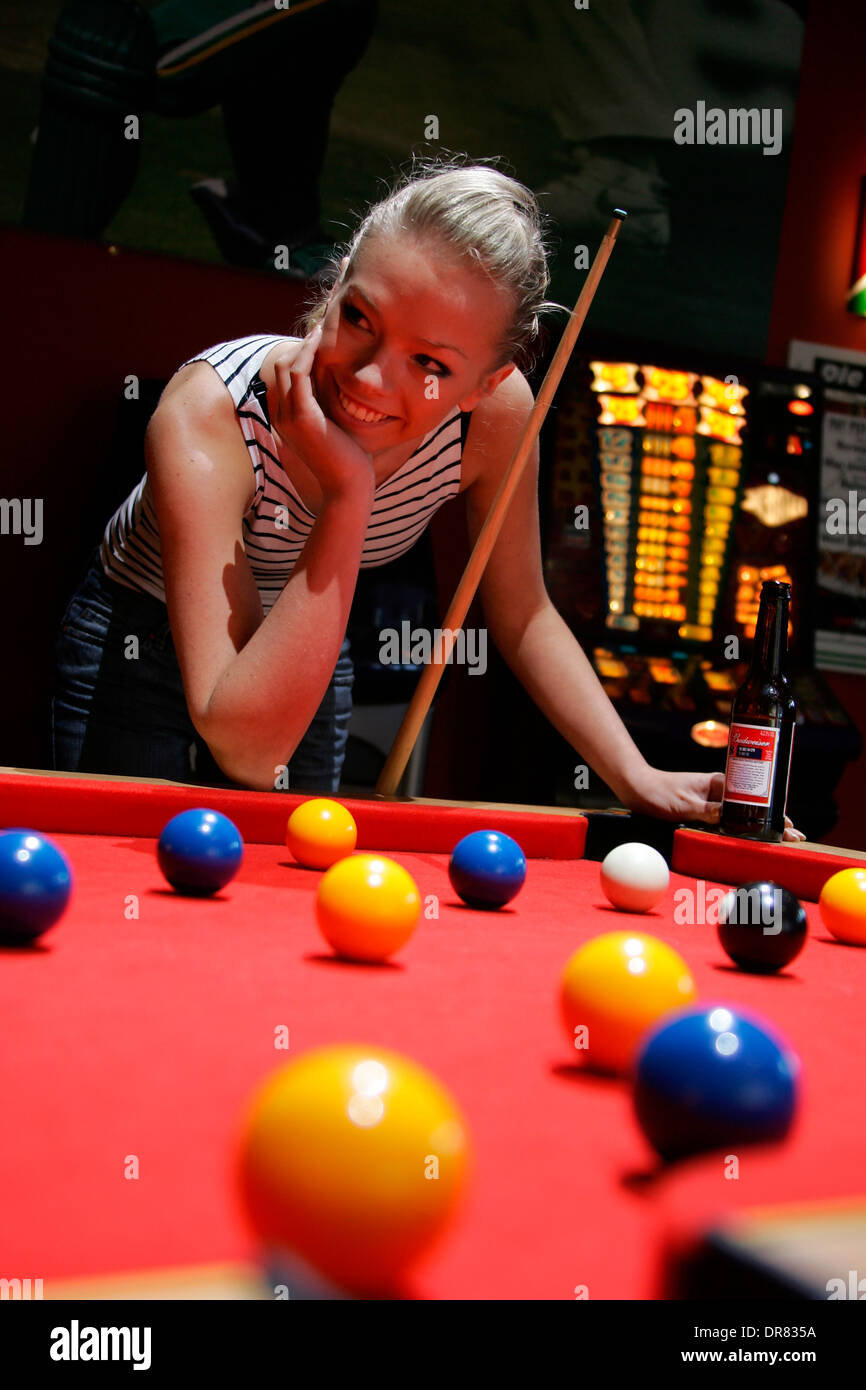 young woman playing pool Stock Photo - Alamy
