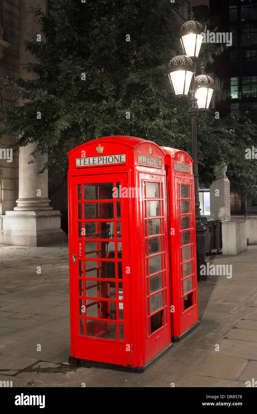 Traditional red telephone boxes in the City of London, England Stock ...