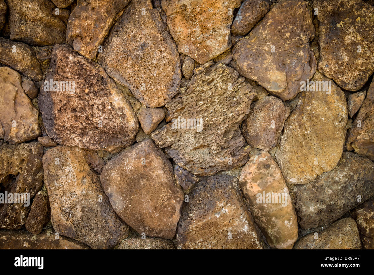 Closeup of stacked lava rock wall texture Stock Photo - Alamy