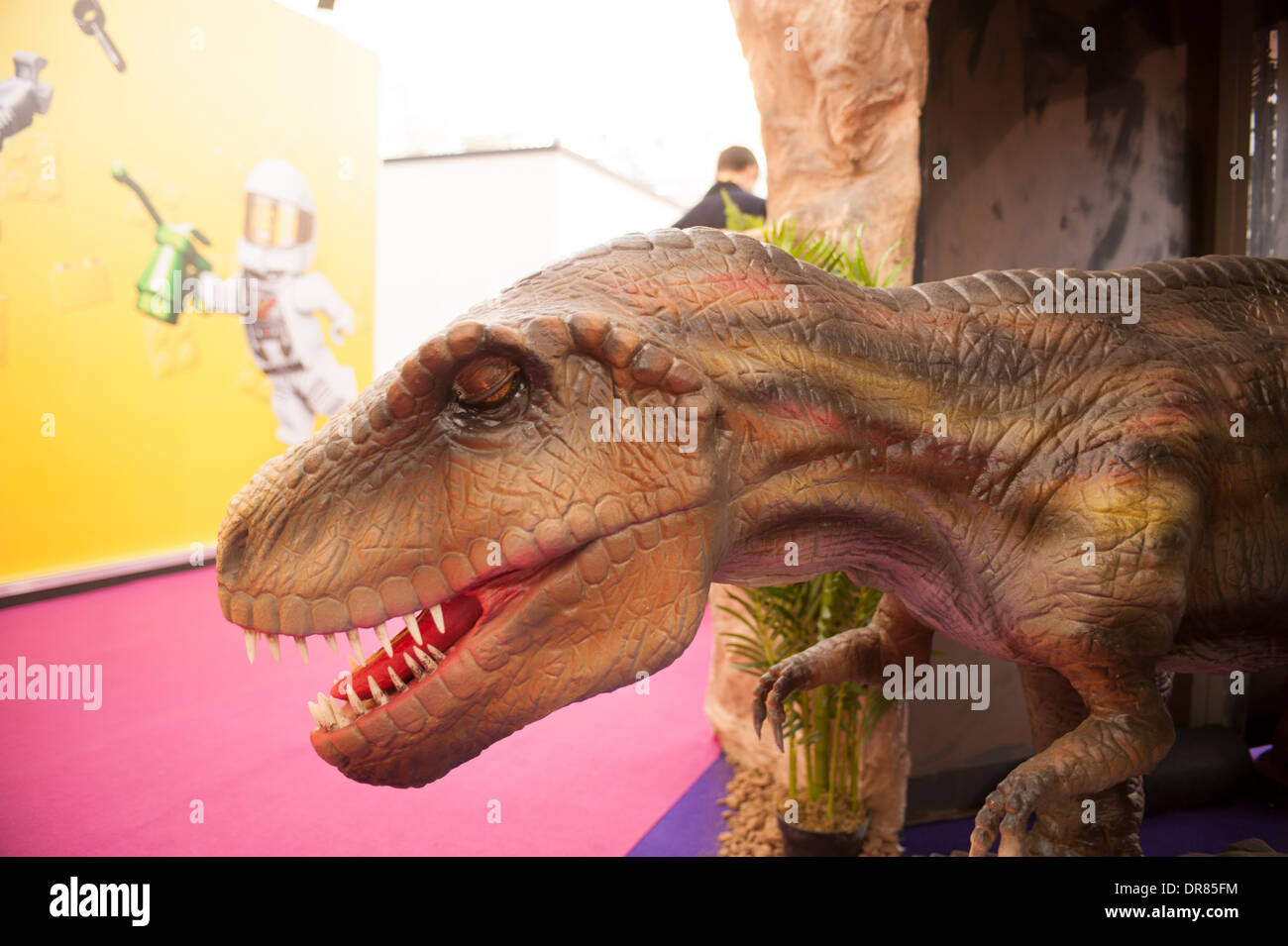 London, UK. 21st January 2014. Animatronic dinosaurs feature on a stand ...