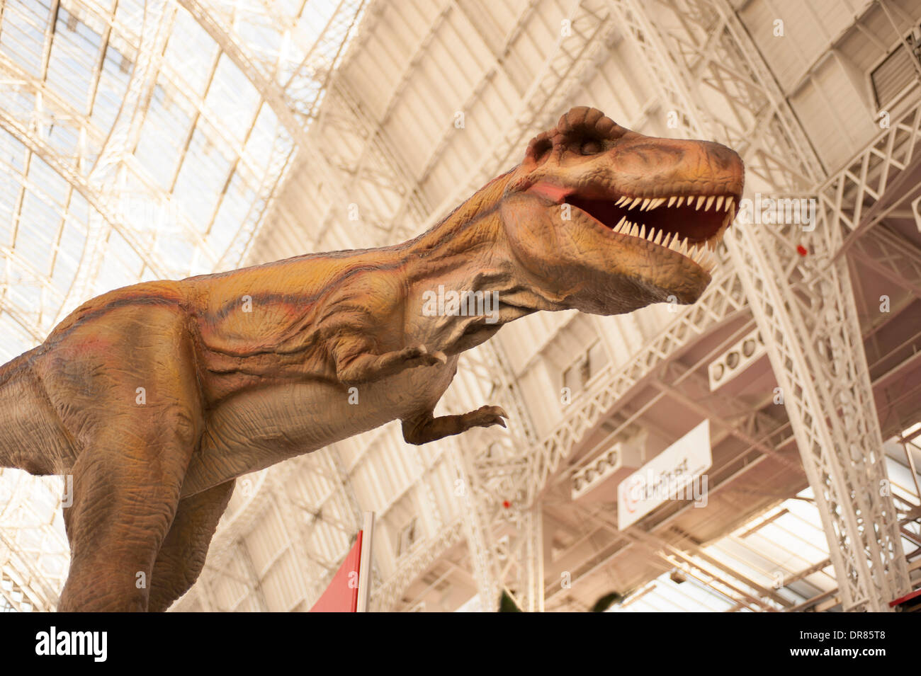 London, UK. 21st January 2014. Animatronic dinosaurs feature on a stand ...