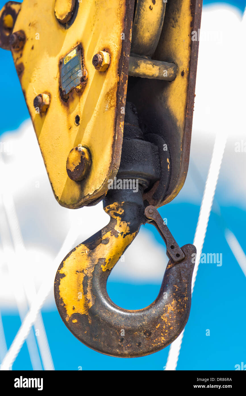 The large hook of a boat hoist Stock Photo - Alamy
