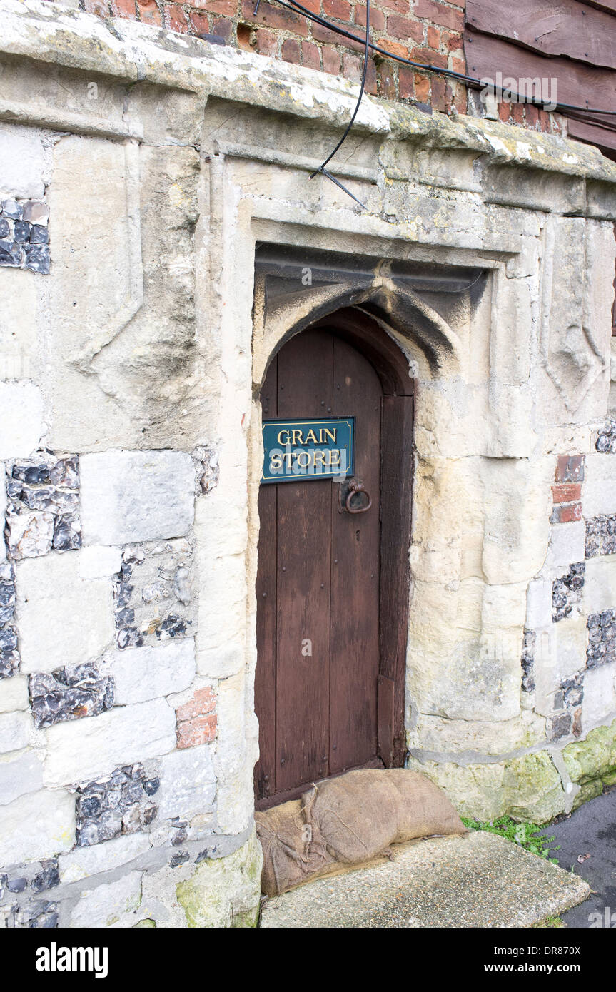 Old grain store door with sandbags to protect from flooding during high ...