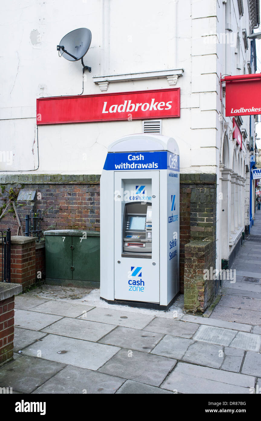 Cash Zone ATM cash dispensing machine under Ladbrokes betting shop sign ...