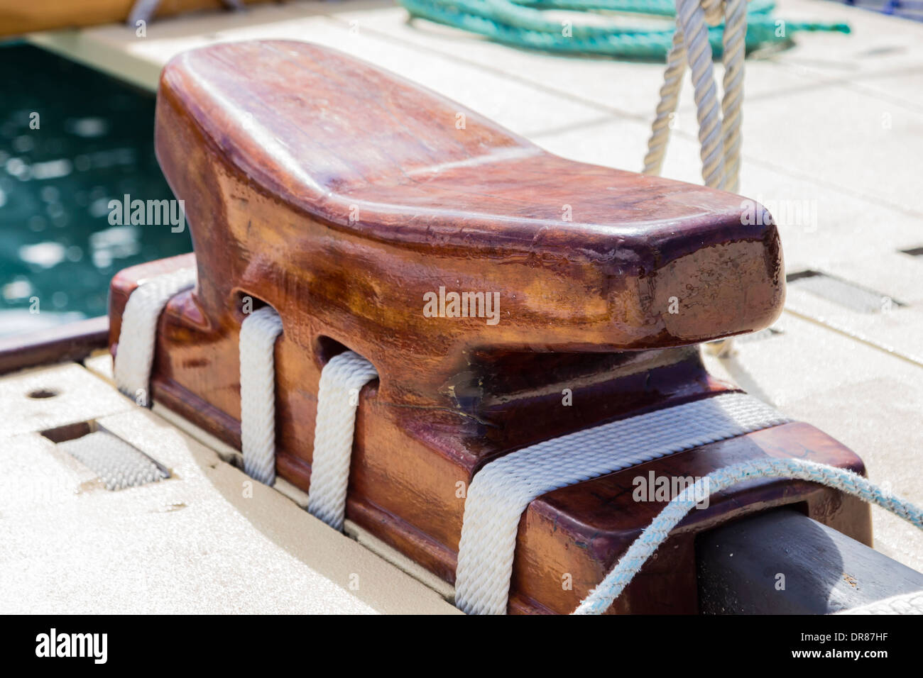 A large wooden cleat onboard the deck of a sailing vessel Stock Photo ...