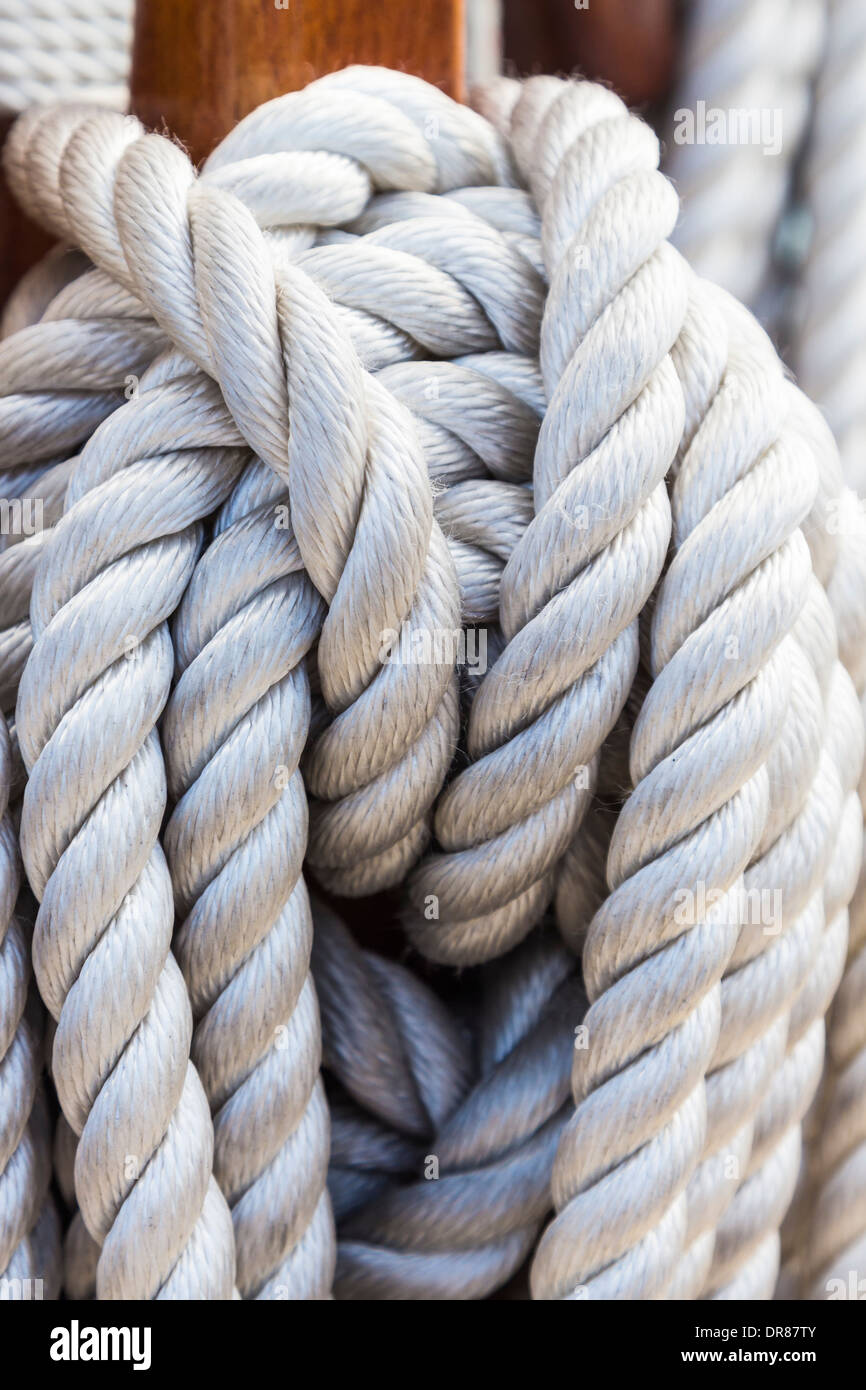 Details of sail rope on the mast of a sailboat Stock Photo - Alamy