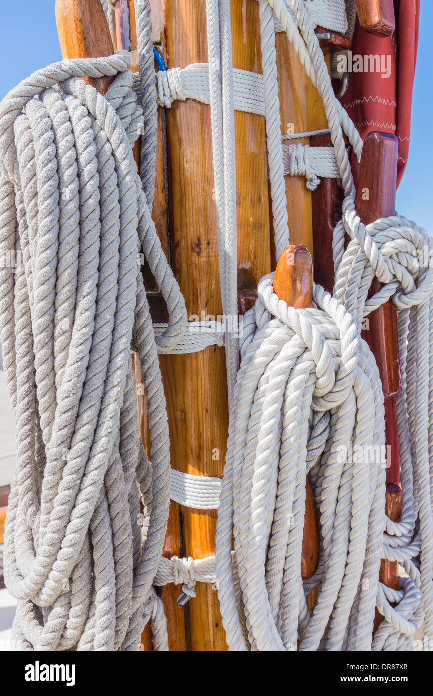 Details of sail rope on the mast of a sailboat Stock Photo - Alamy