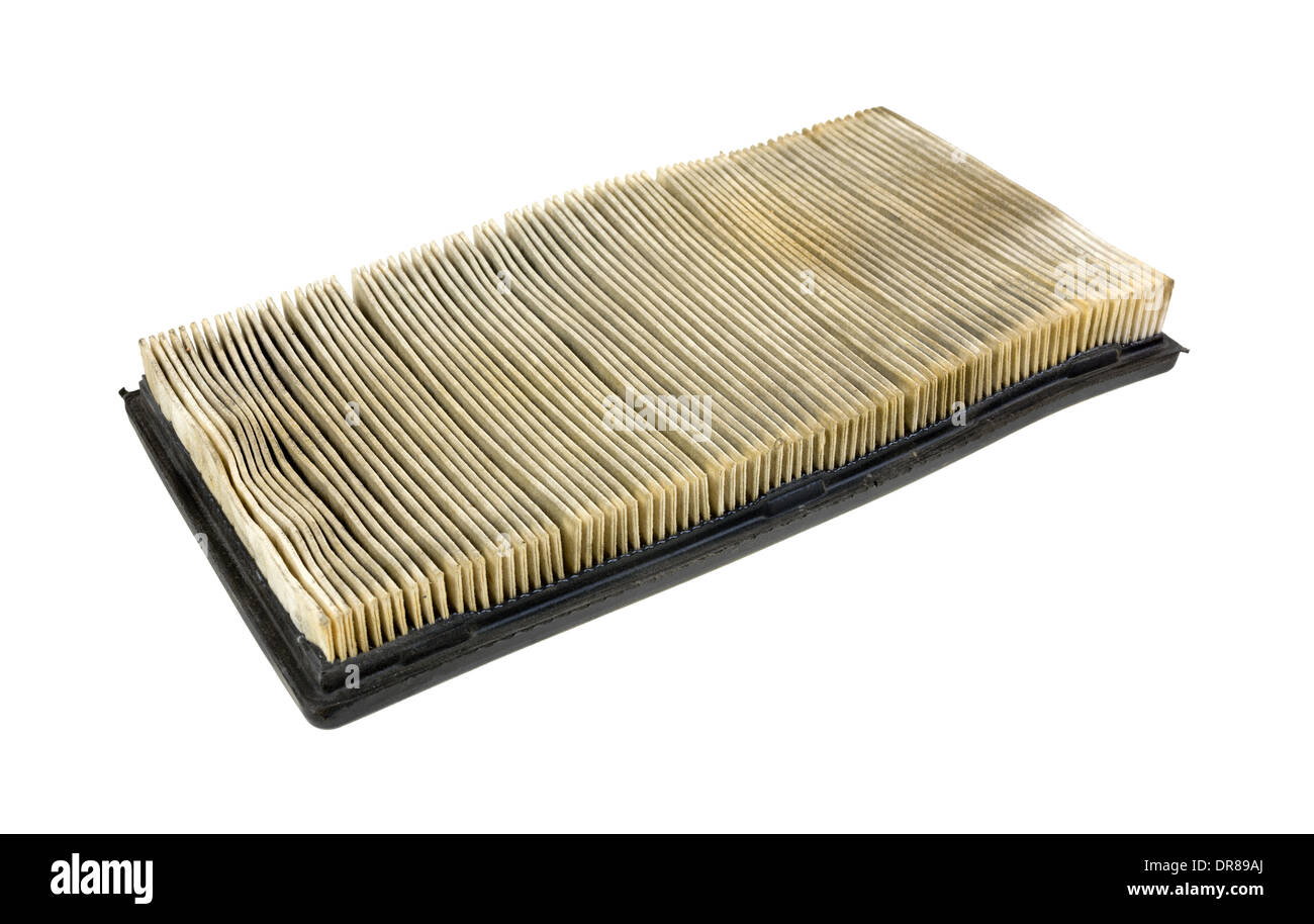 Side view of a used and dirty automobile air filter on a white ...