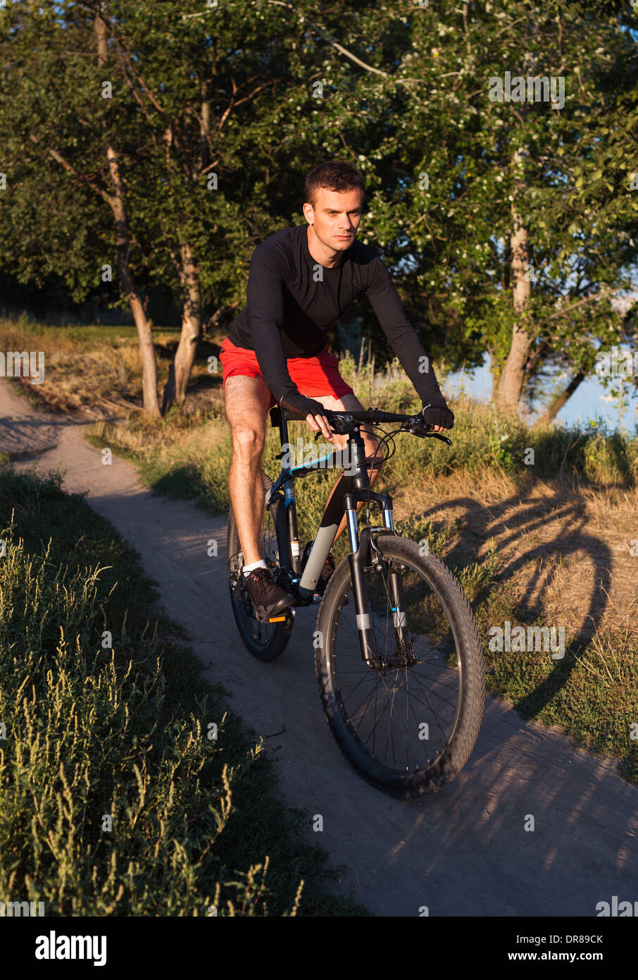 Mountain bike cyclist riding at sunrise healthy lifestyle active ...