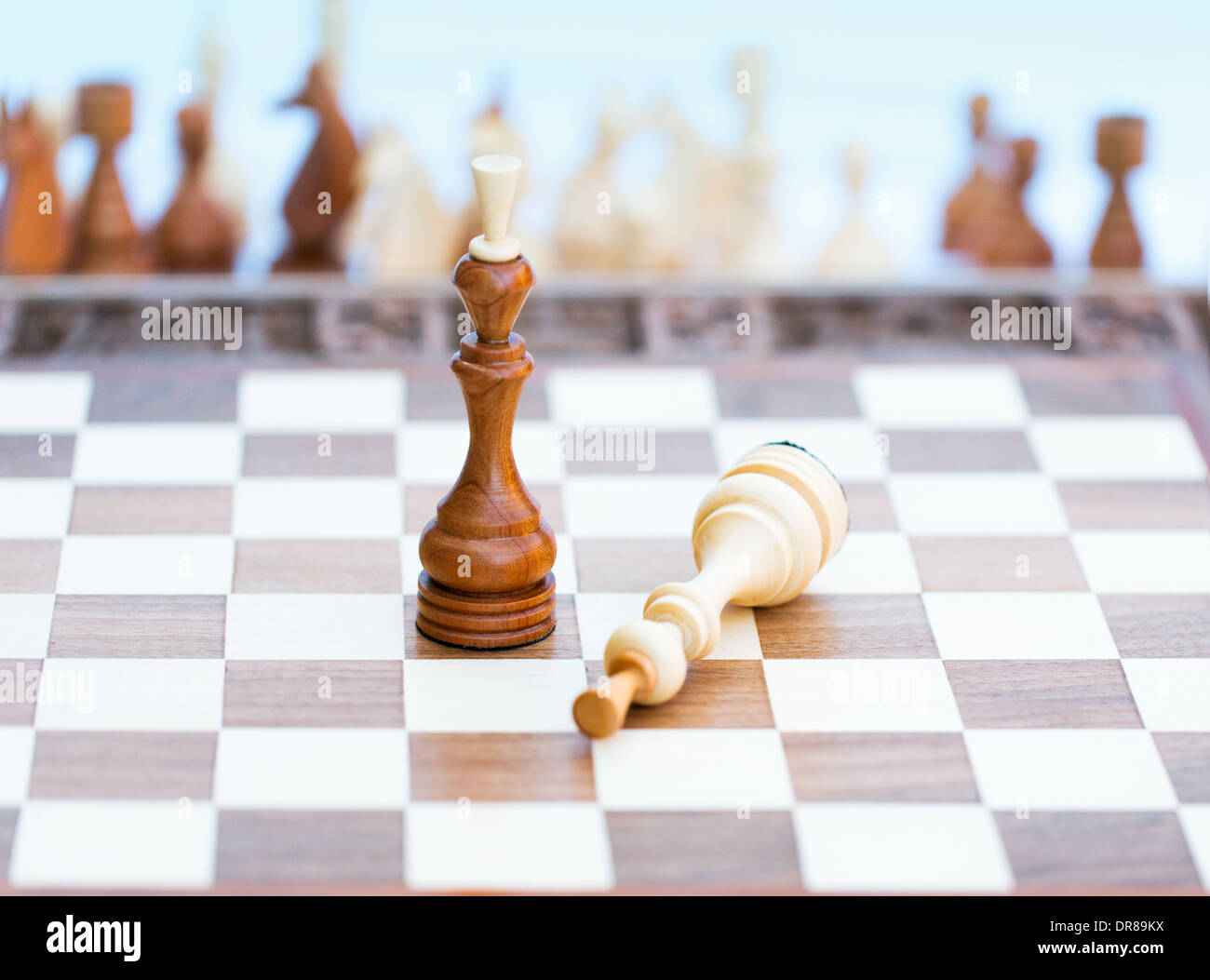 Two wooden chess pieces alone on a chess board Stock Photo - Alamy