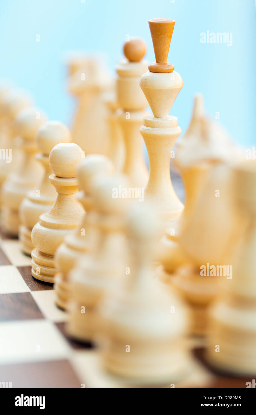 Chess pieces on the board. Focus on King Stock Photo - Alamy